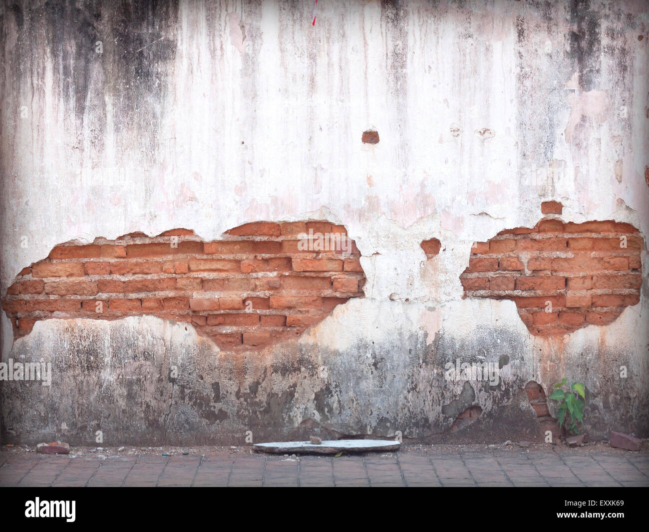 Decayed, cracked concrete vintage brick wall background Stock Photo - Alamy