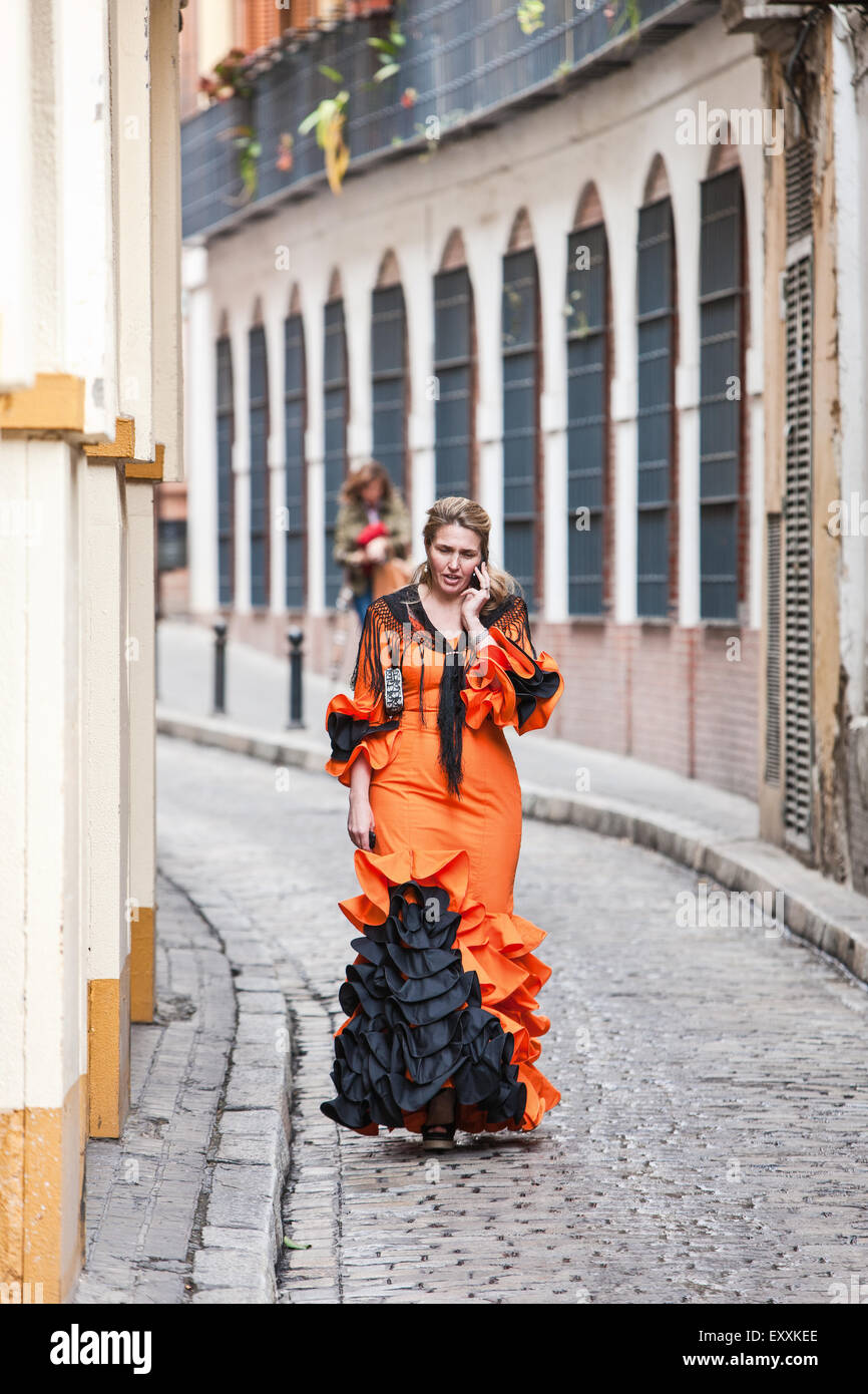 In traditional Seville dress in Old Town of Seville, Andalucia, Spain ...