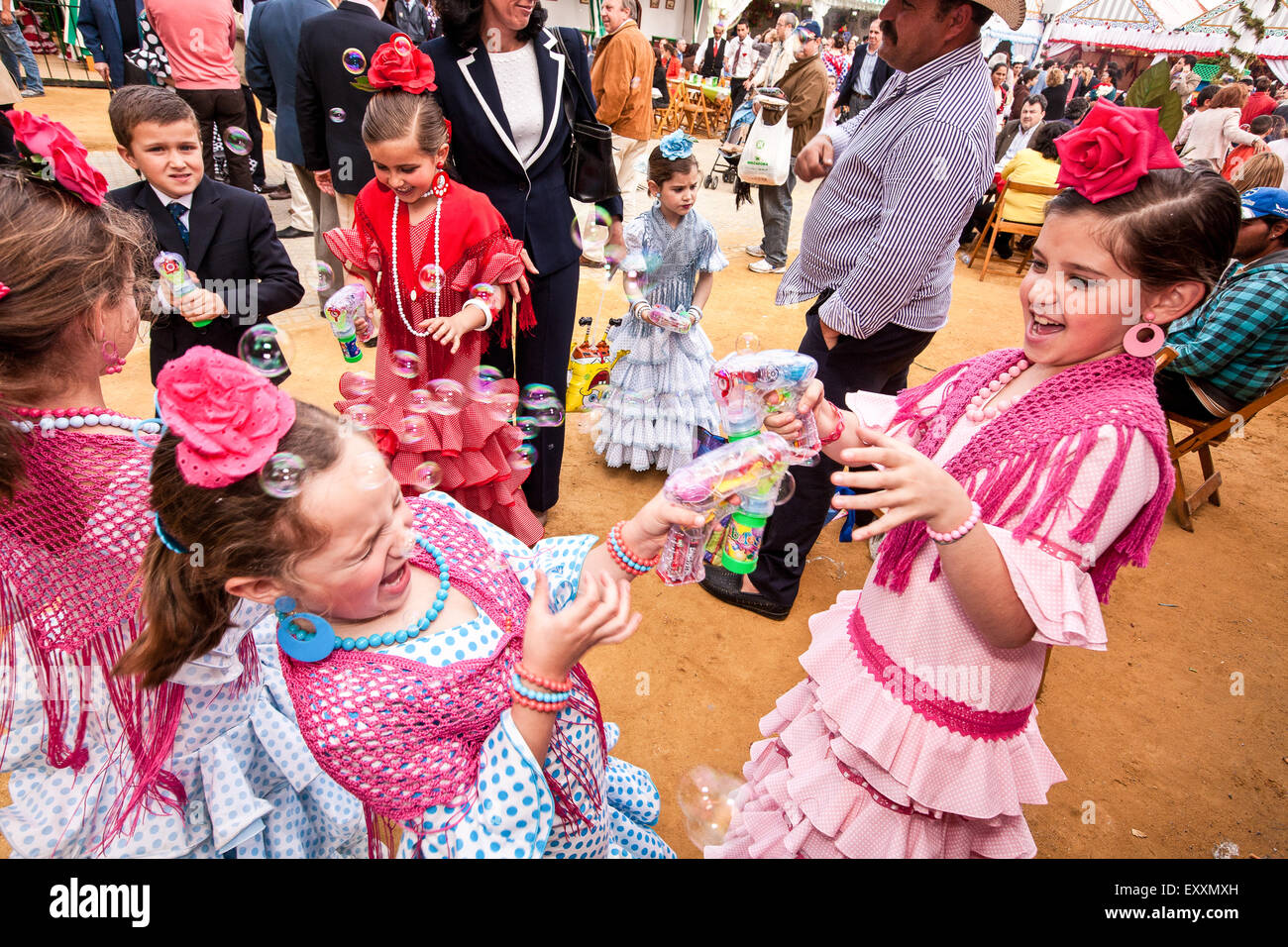 Children in traditional Seville dress playing in Seville, Andalucia ...