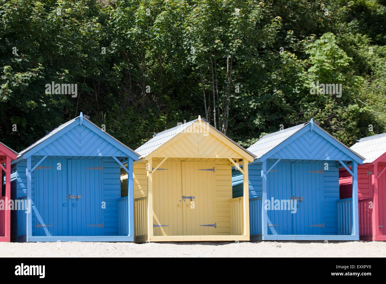 Colourful beach huts at a traditional British Beach Stock Photo - Alamy