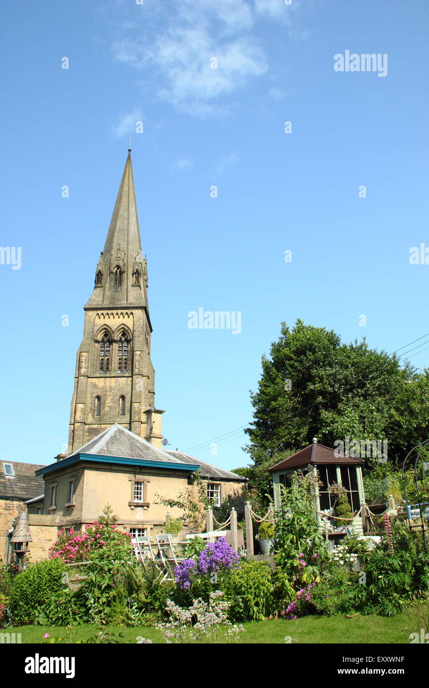 The spire of St Peter's Church rises above Edensor, an idyllic village ...