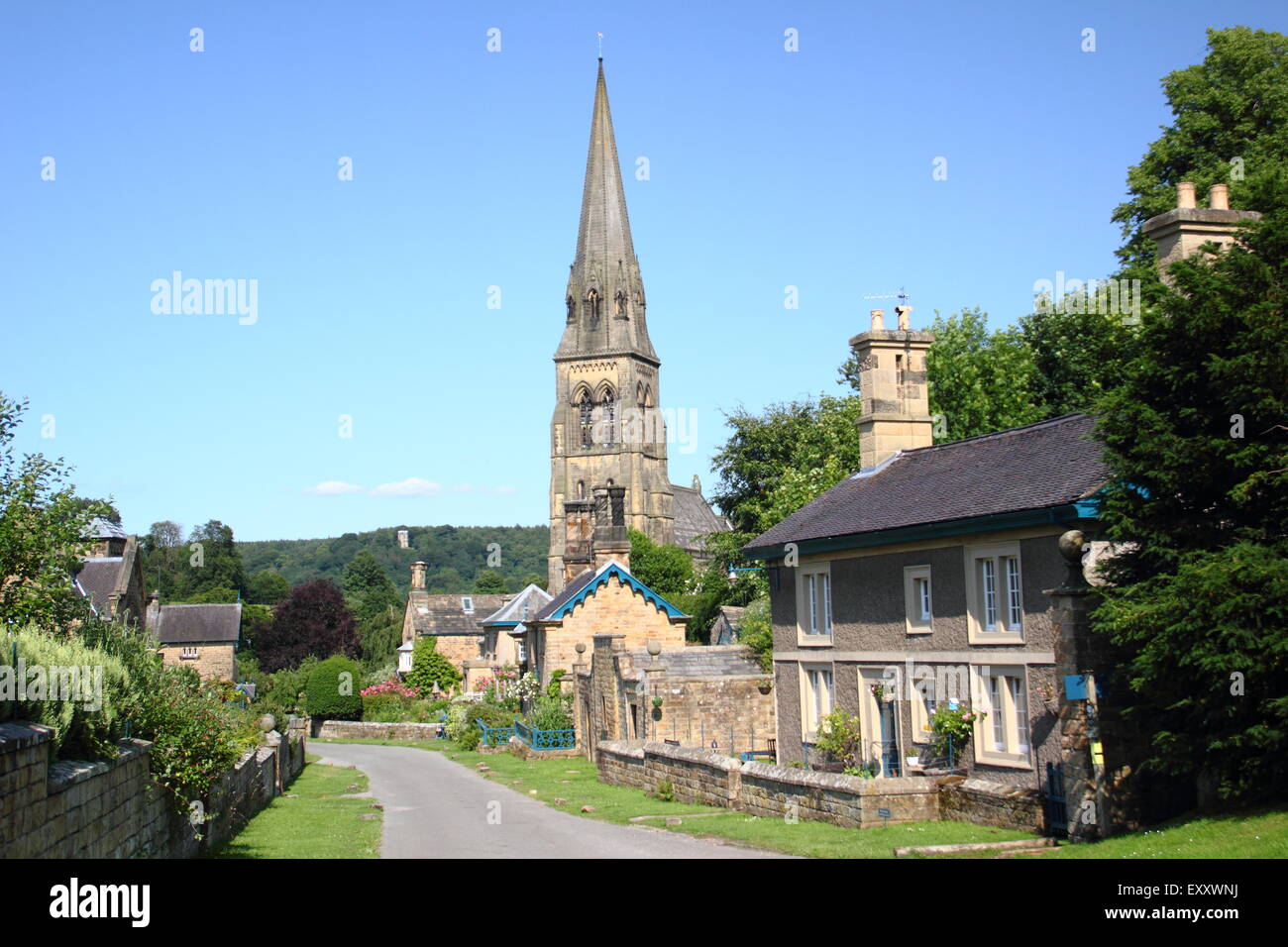 The spire of St Peter's Church rises above Edensor, an idyllic village ...