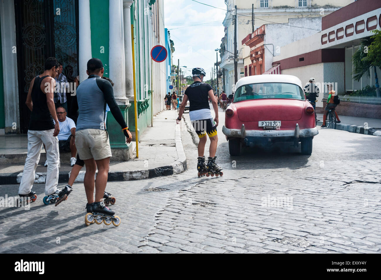 Kids Rollerblade on the cobblestone streets of Santa Clara, Cuba Stock ...