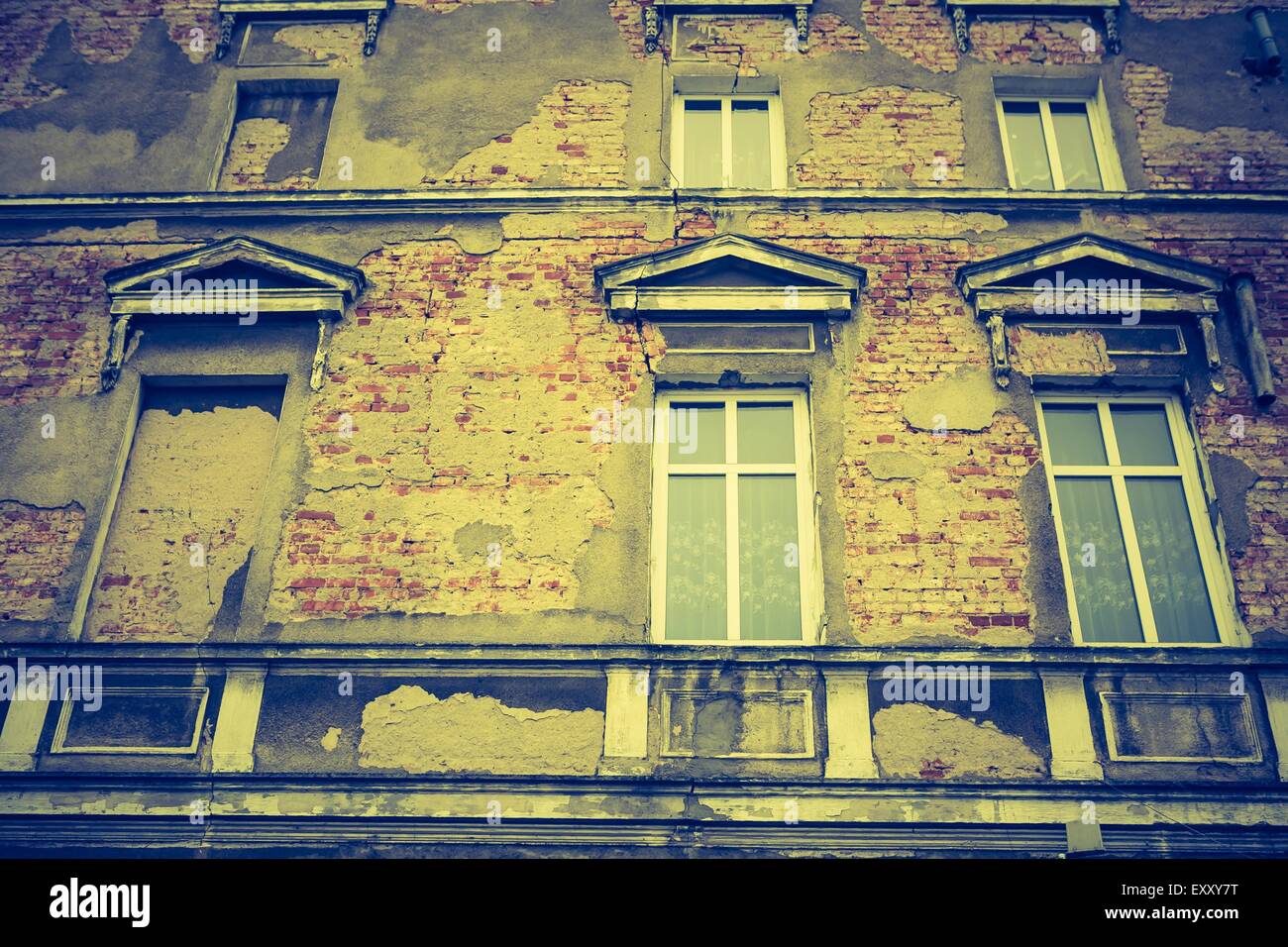 Vintage photo of old abandoned building with windows in old town Stock ...