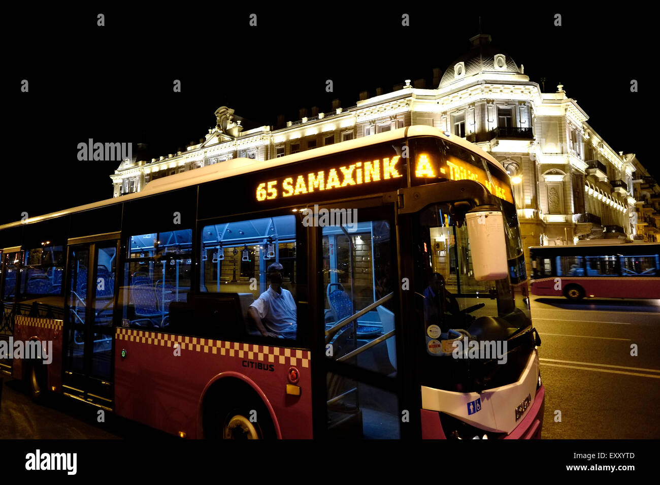 Buses driving through the center city of Baku capital of Azerbaijan ...