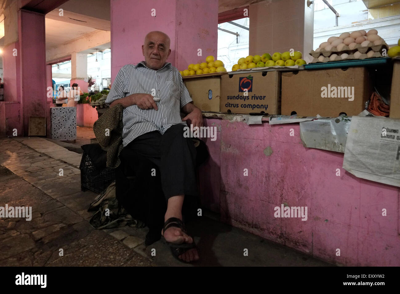 A vendor in Taza Bazaar market in the city of Baku in Azerbaijan Stock ...