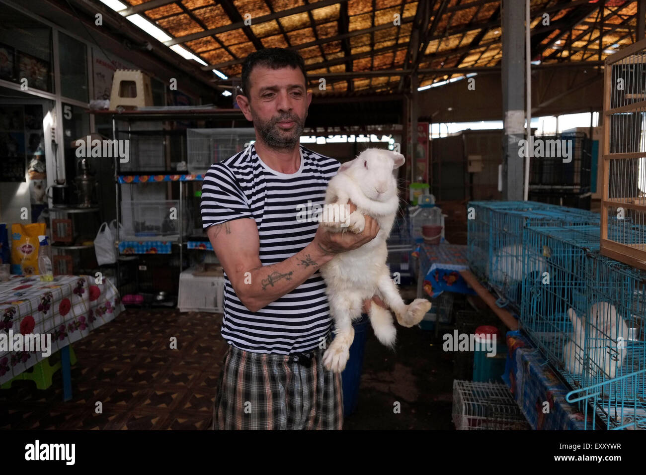 A pet vendor in Taza Bazaar market in the city of Baku in Azerbaijan ...