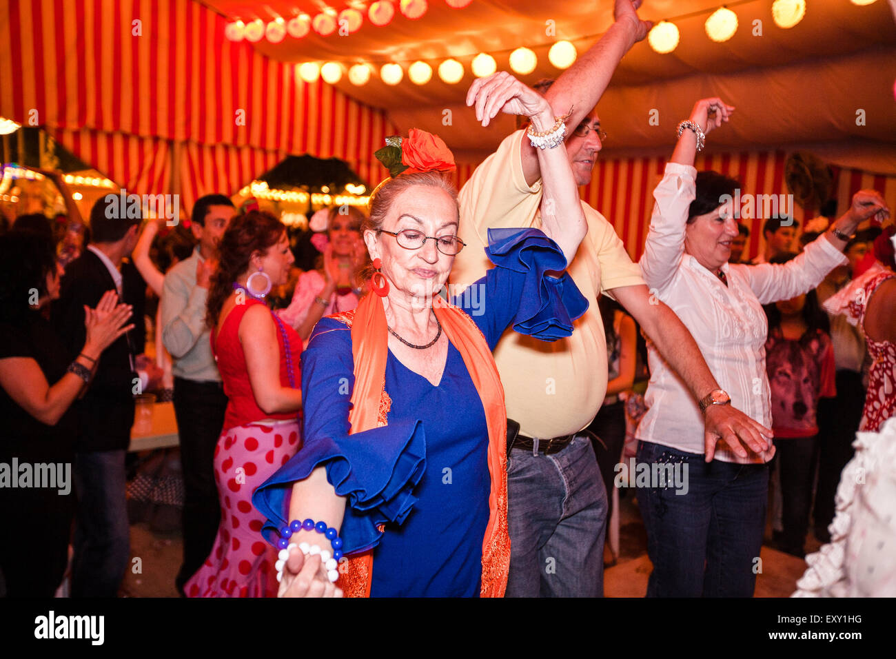 Dancing Sevilla style. In large tent used by general public. In ...