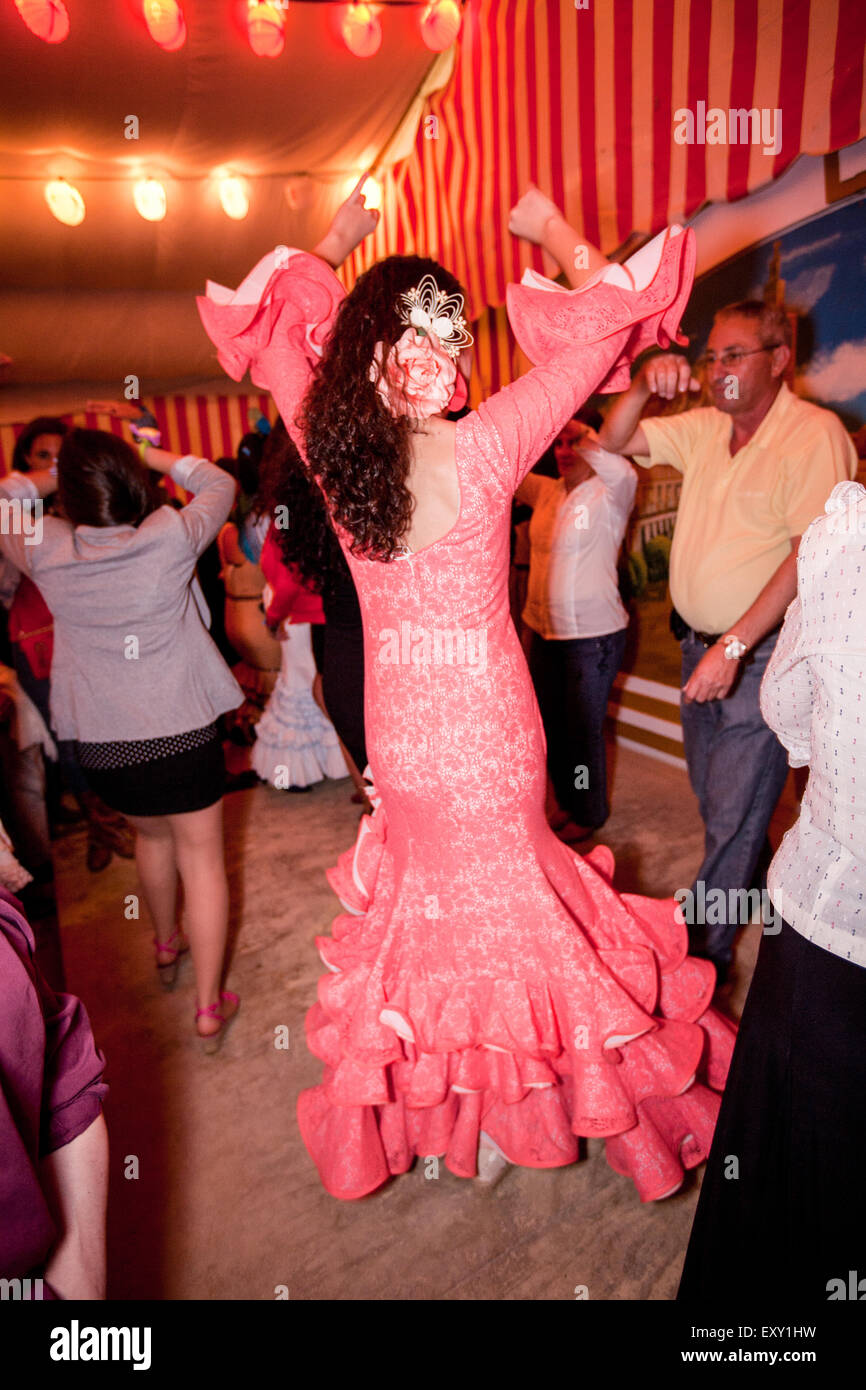 Dancing Sevilla style. In large tent used by general public. In ...