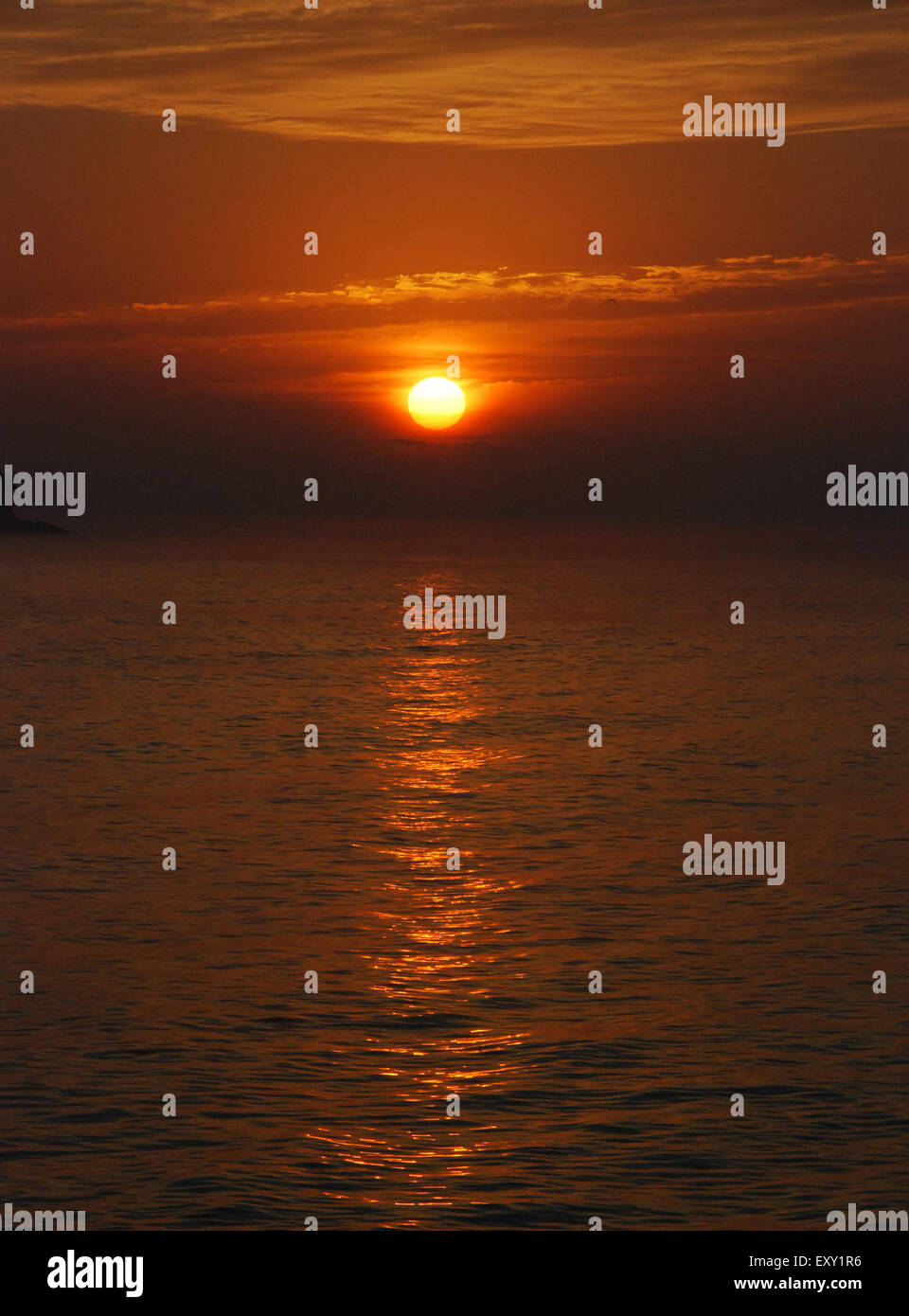 An early morning sunrise over a lake Stock Photo - Alamy