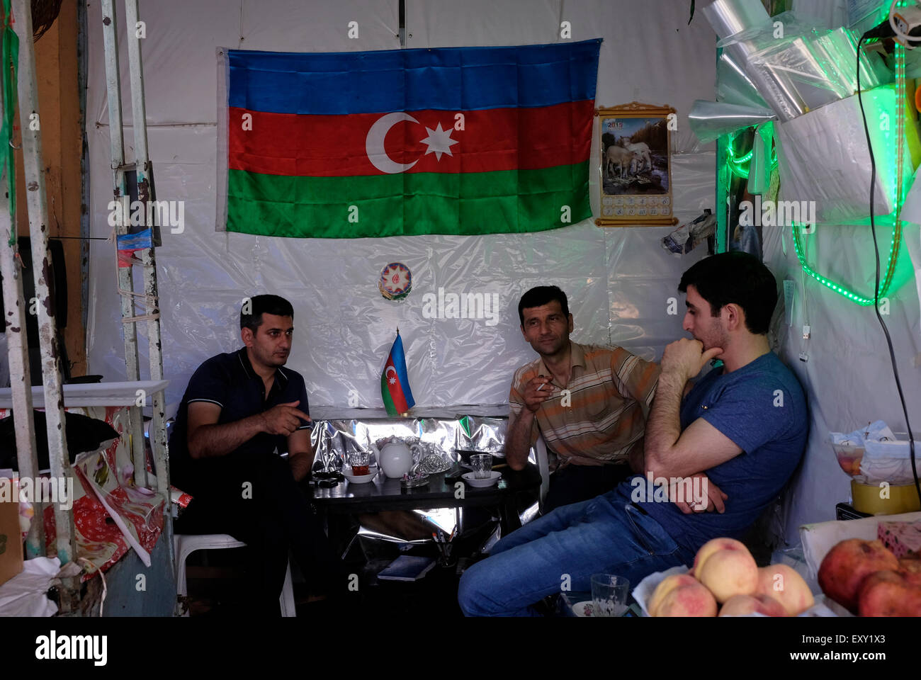 Vendors with the Azerbaijani flag in Taza Bazaar market in the city of ...