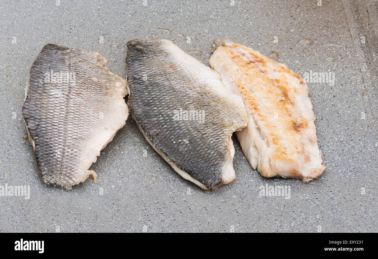 Pictured three fillets of sea bream cooked on the grill Stock Photo - Alamy