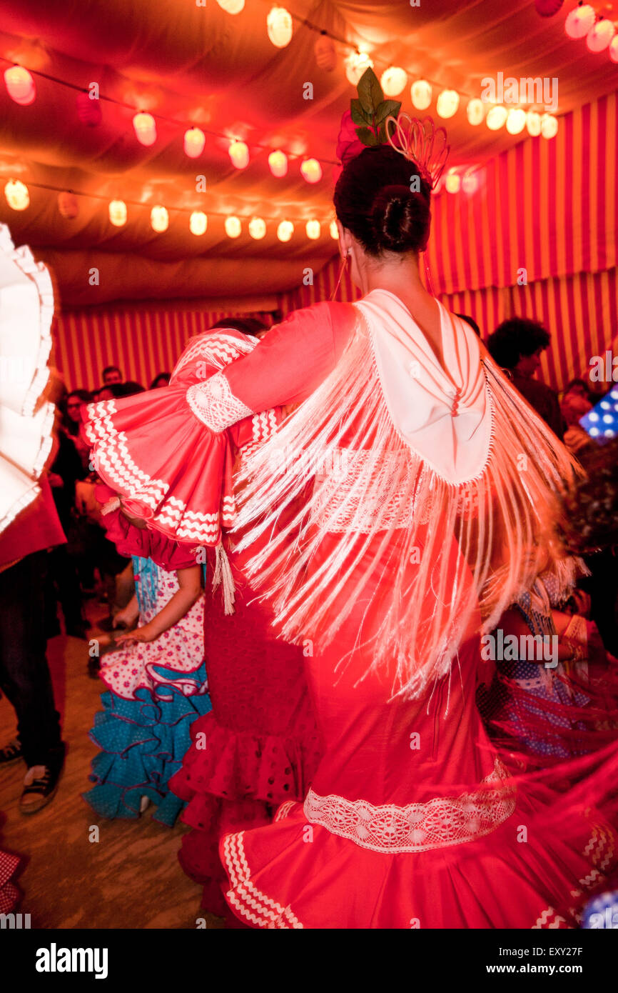 Dancing Sevilla style. In large tent used by general public. In ...