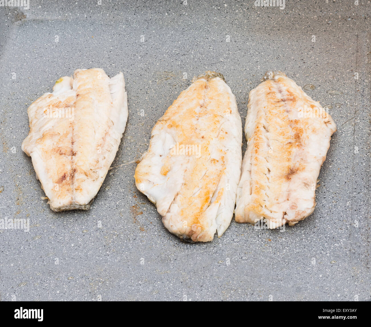 Pictured three fillets of sea bream cooked on the grill Stock Photo - Alamy
