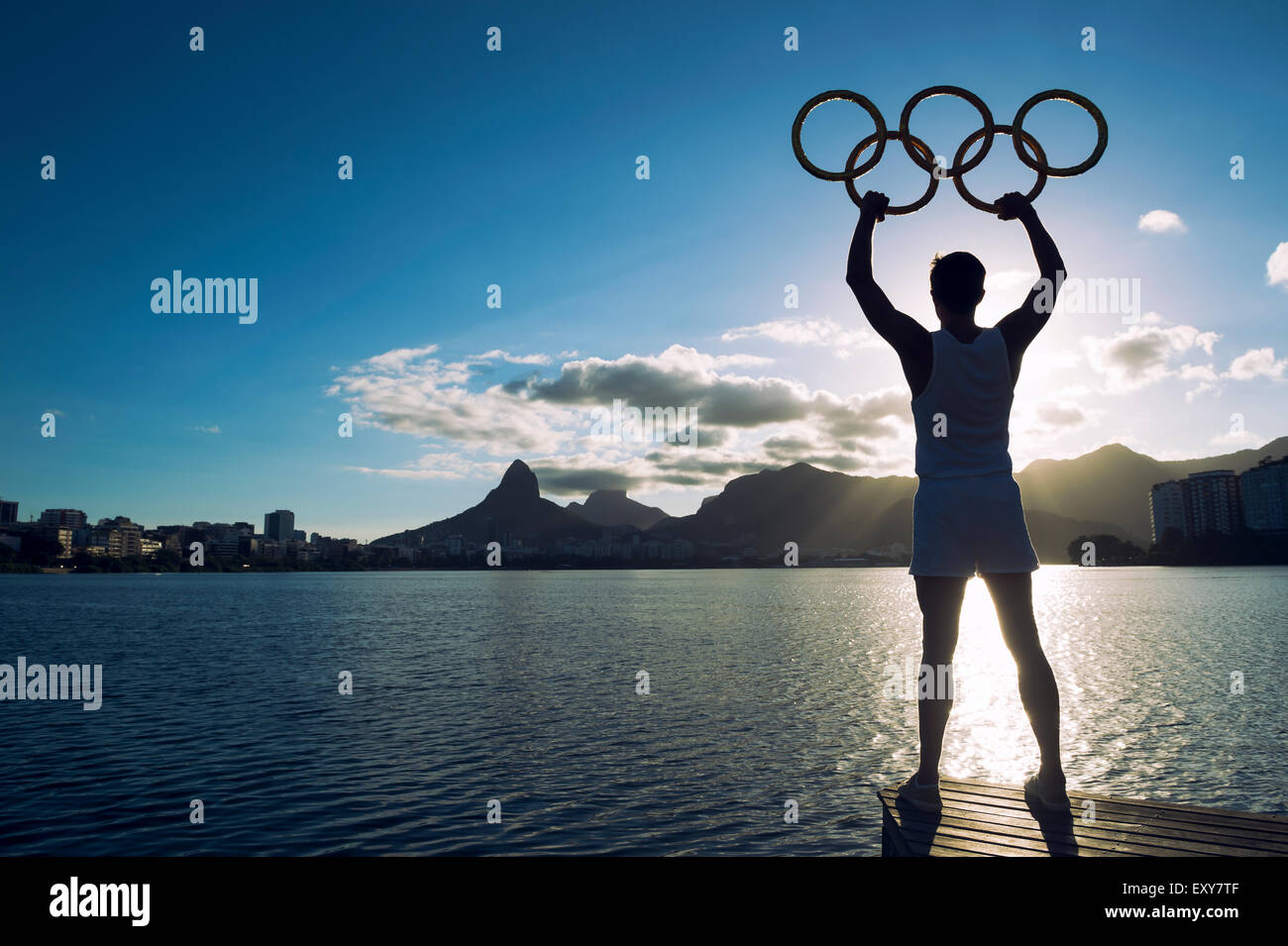 RIO DE JANEIRO, BRAZIL - MARCH 05, 2015: Athlete holds Olympic rings ...