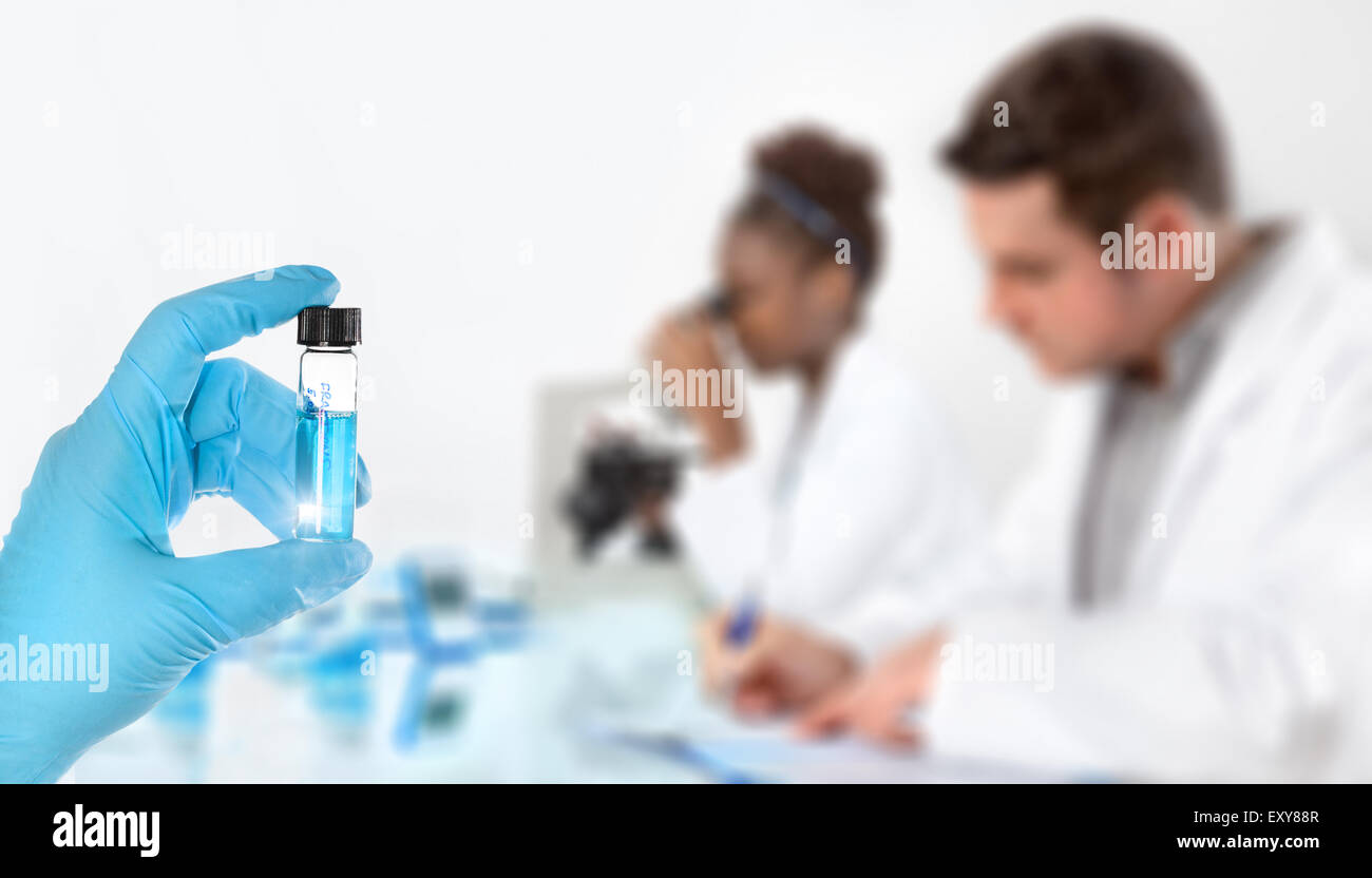 Modern science background. Hand in blue glove with sample, working ...