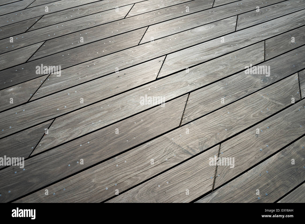 Weathered smooth wood plank background textured with modern angular ...