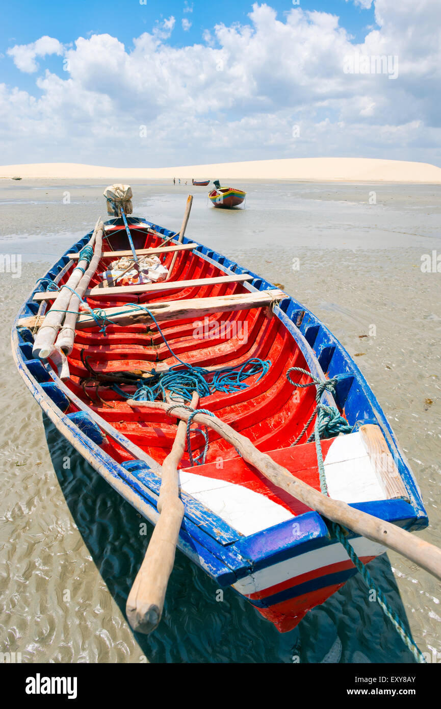 Traditional colorful Brazilian fishing boat on the beach in ...
