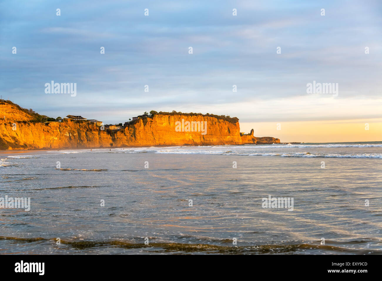 Golden light falling on the cliffs near the beach town of Montanita ...