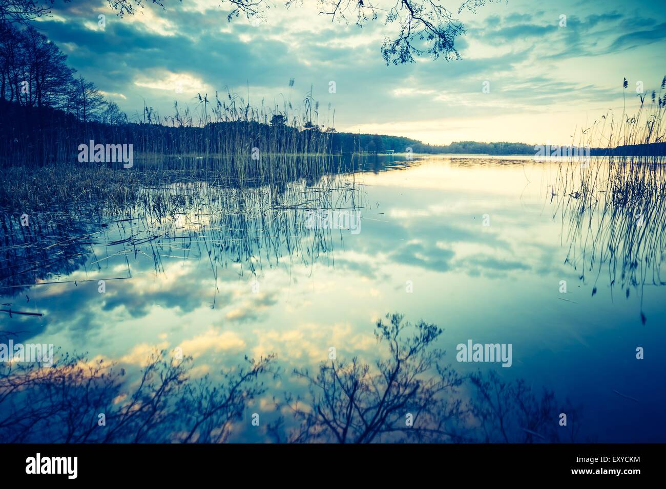 Vintage photo of sunset lake, calm landscape with old photo mood Stock ...