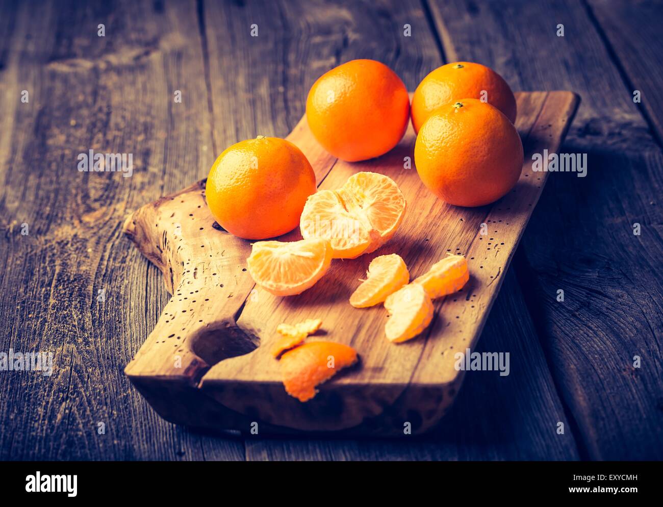 Vintage photo of fresh tangerines on wooden cutting board. Photo with ...