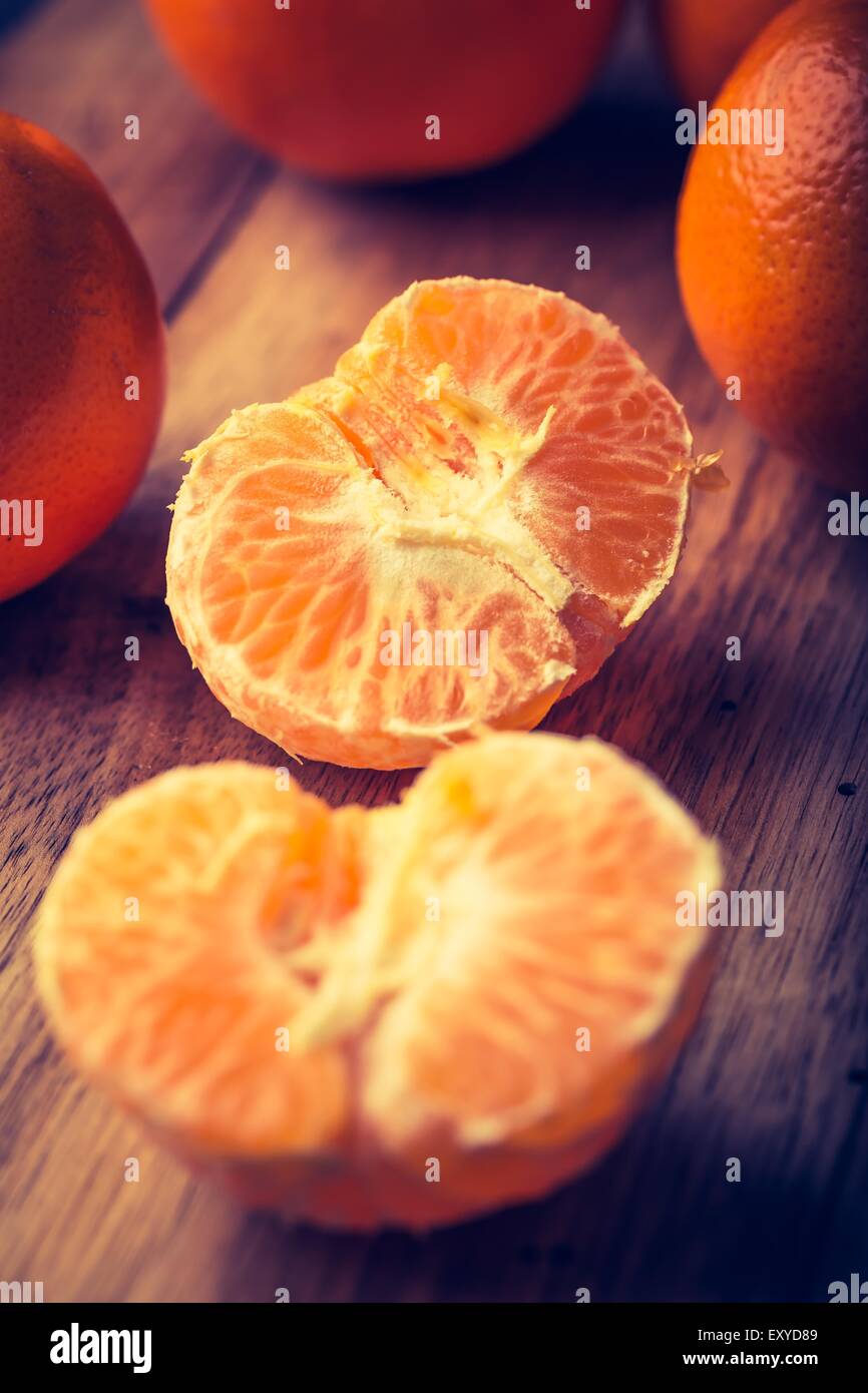 Vintage photo of fresh tangerines on wooden cutting board. Photo with ...
