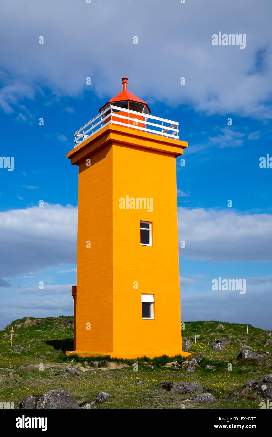 An orange lighthouse seen at the westcoast of Iceland Stock Photo - Alamy