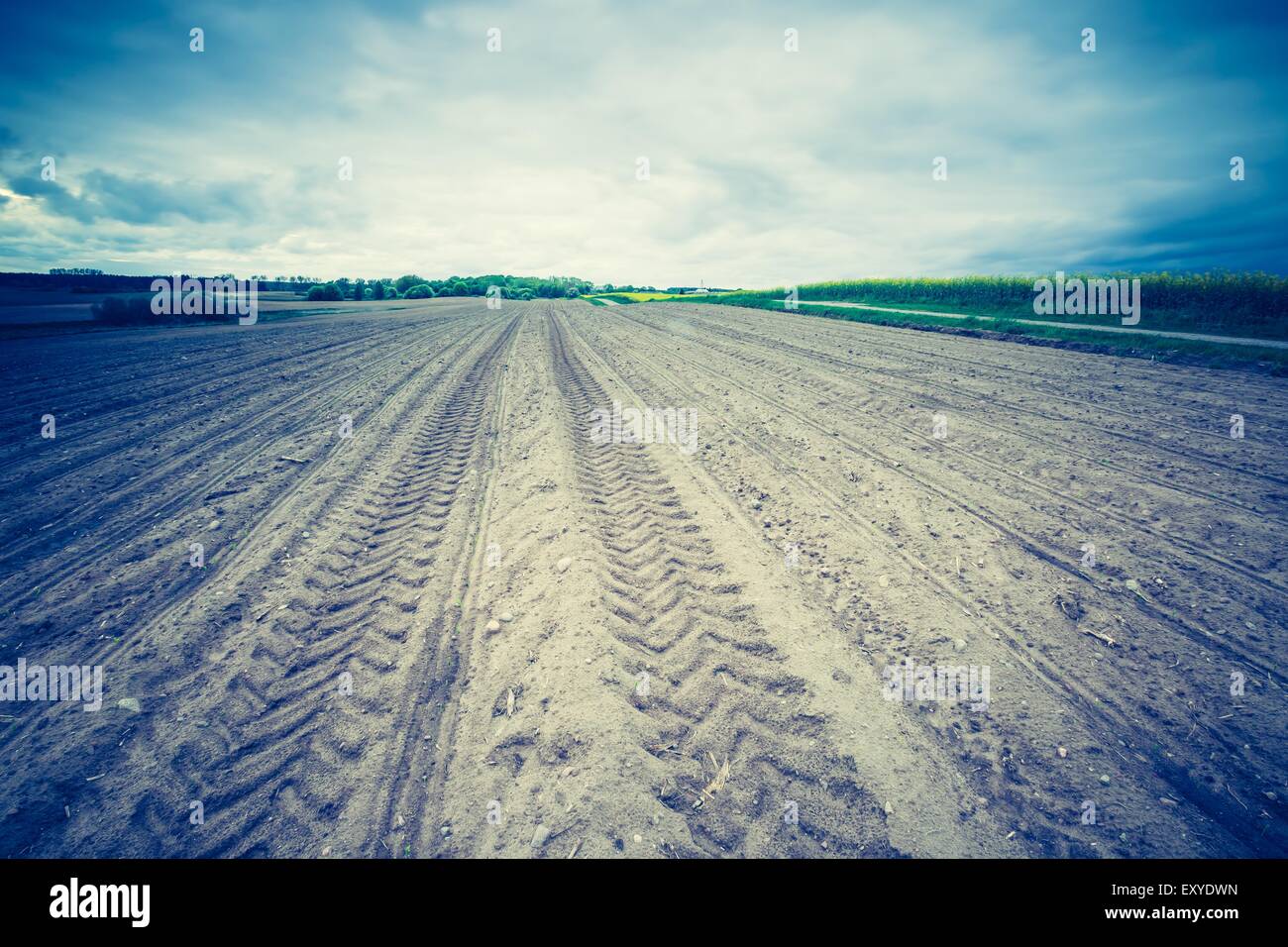Vintage photo of plowed field in calm countryside. Agricultural ...