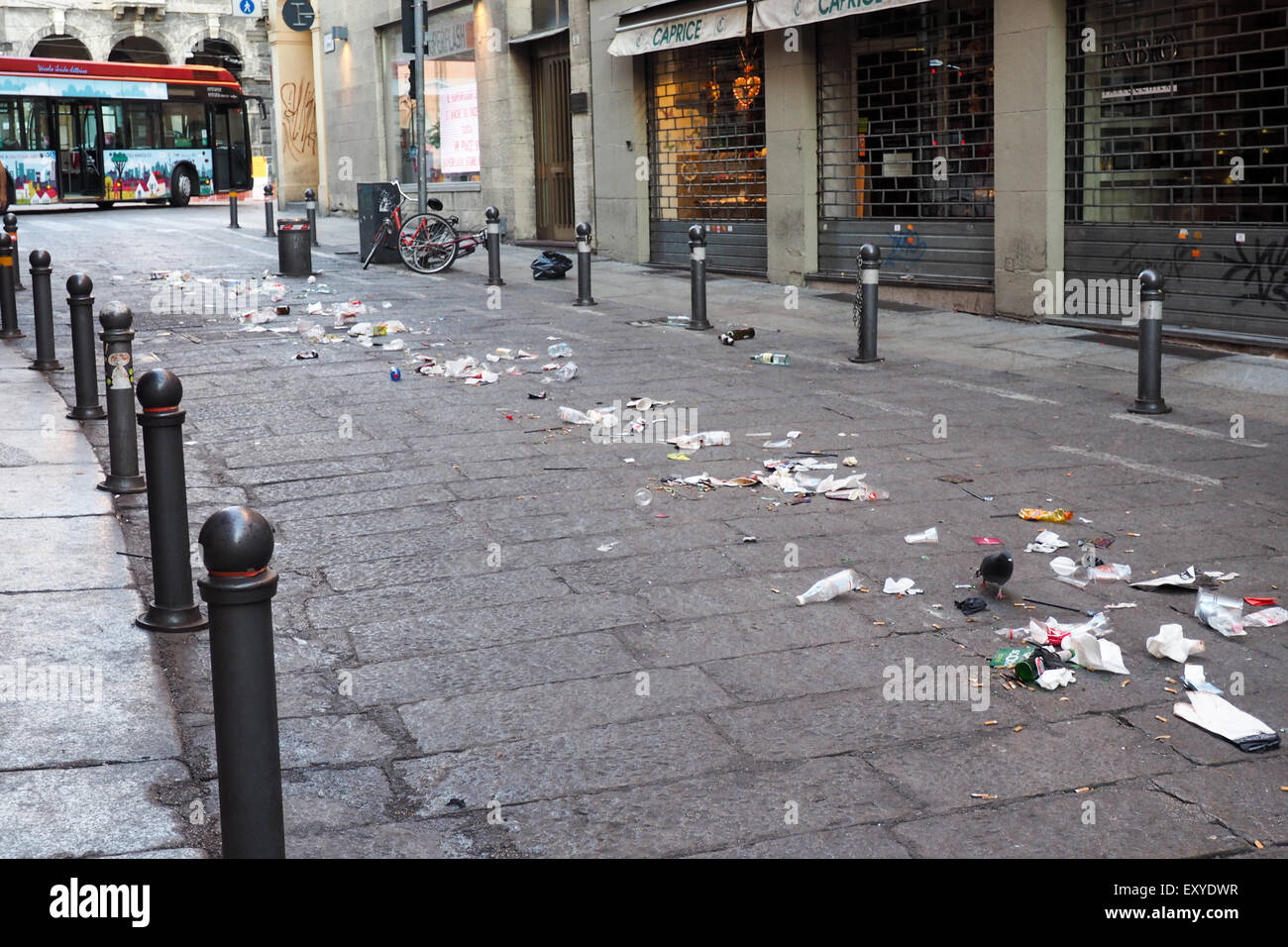 Litter on the street in central Bologna Stock Photo - Alamy