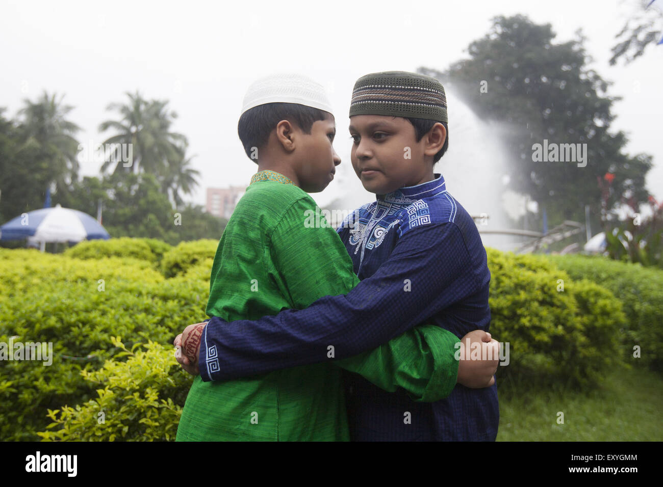 Dhaka, Bangladesh. 18th July, 2015. Bangladeshi Muslim hug each other ...