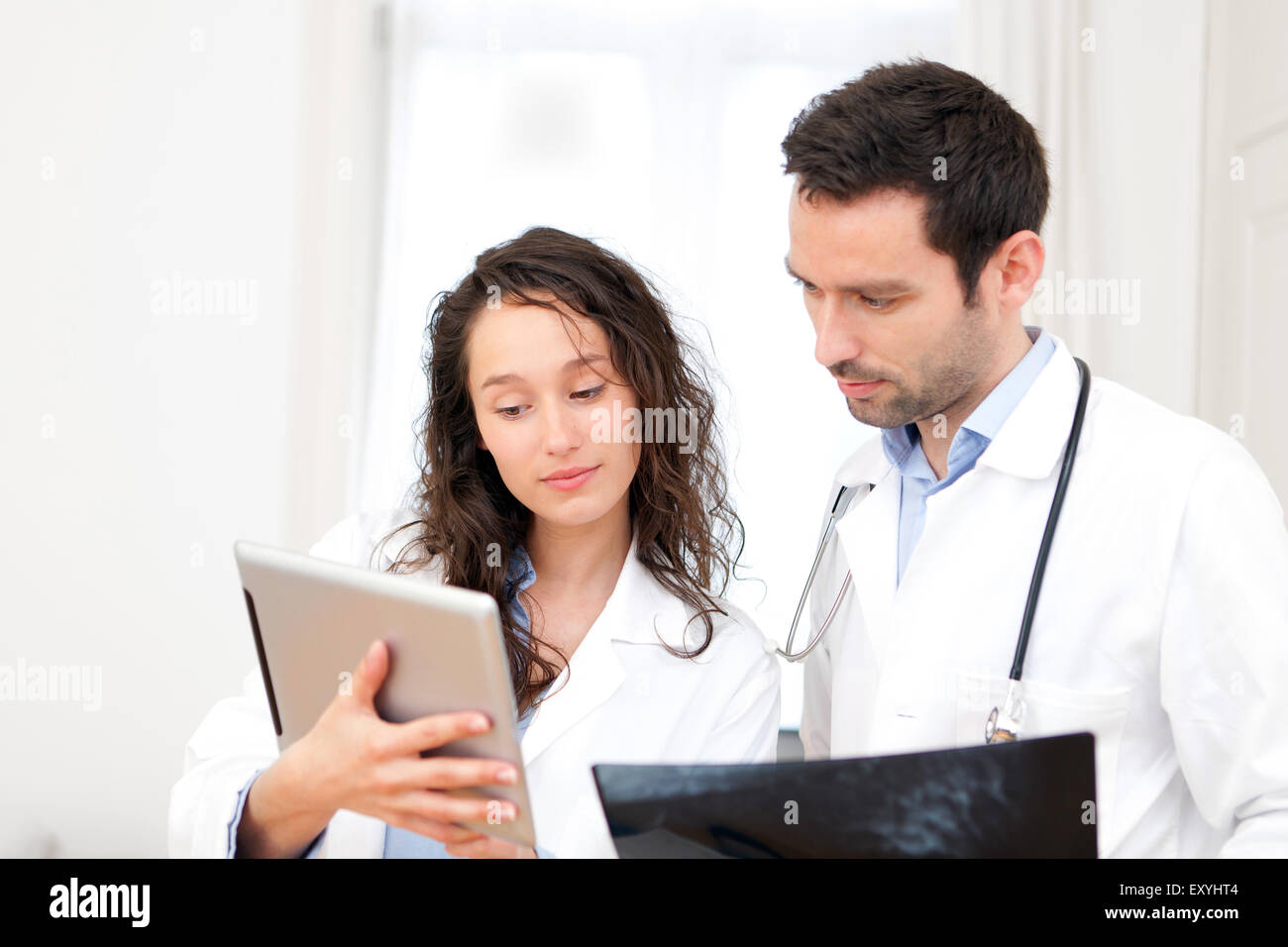 View of a Young doctor and nurse analysing radiography Stock Photo - Alamy