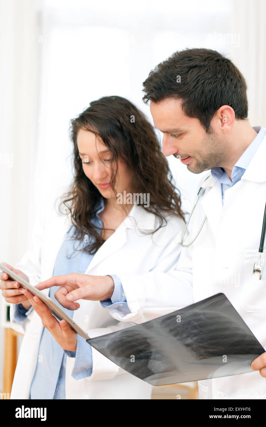 View of a Young doctor and nurse analysing radiography Stock Photo - Alamy