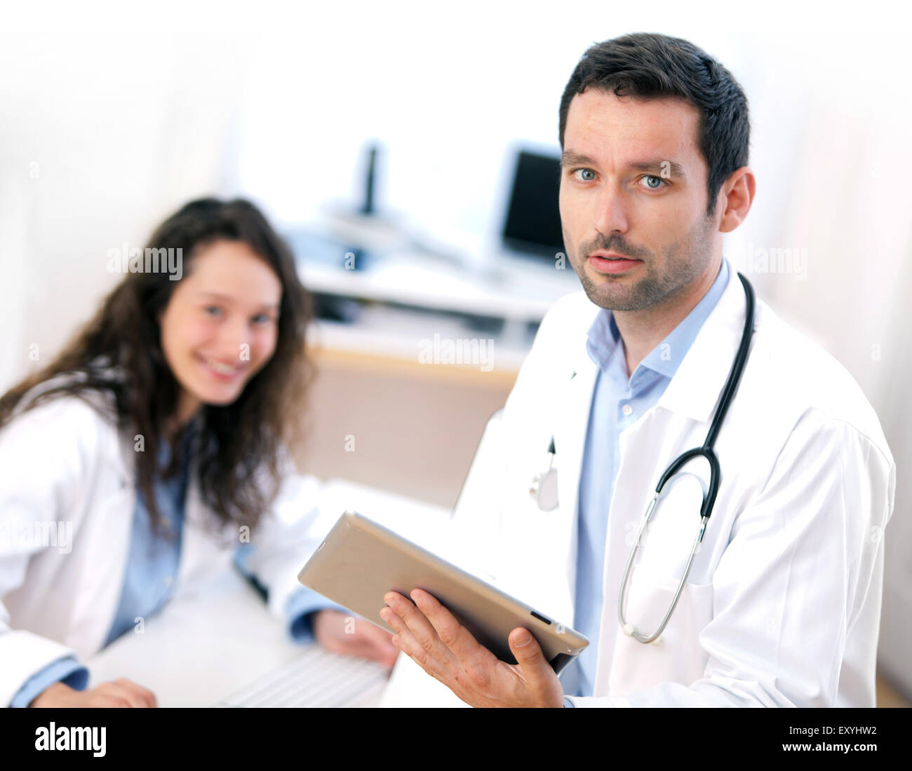 Smile doctor woman tablet hi-res stock photography and images - Alamy