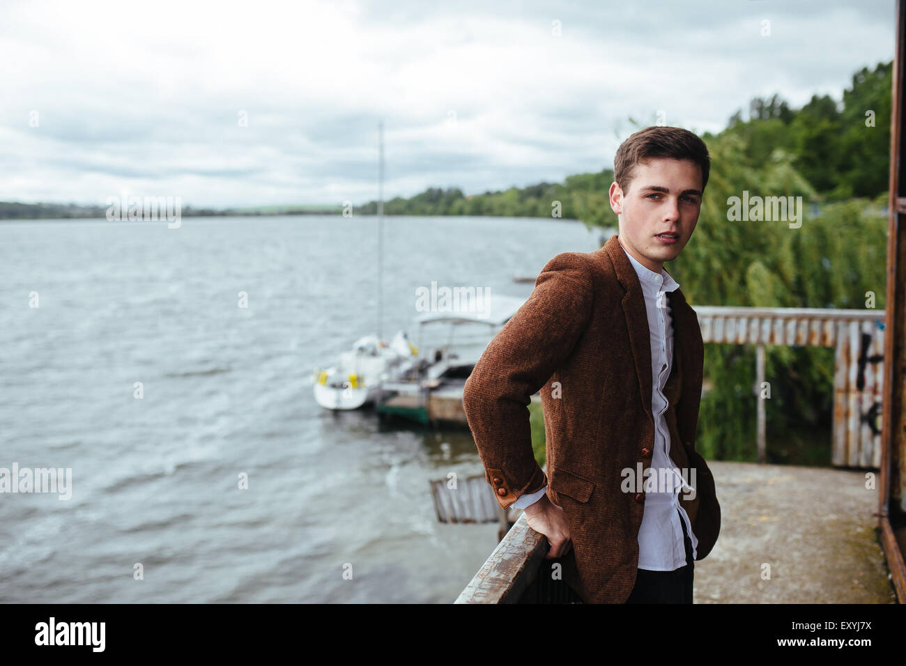 man standing on a pier Stock Photo - Alamy