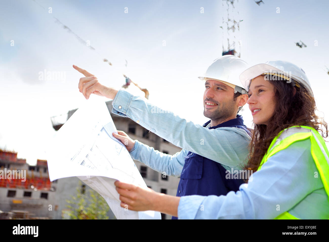 View of Co-workers on a construction site Stock Photo - Alamy