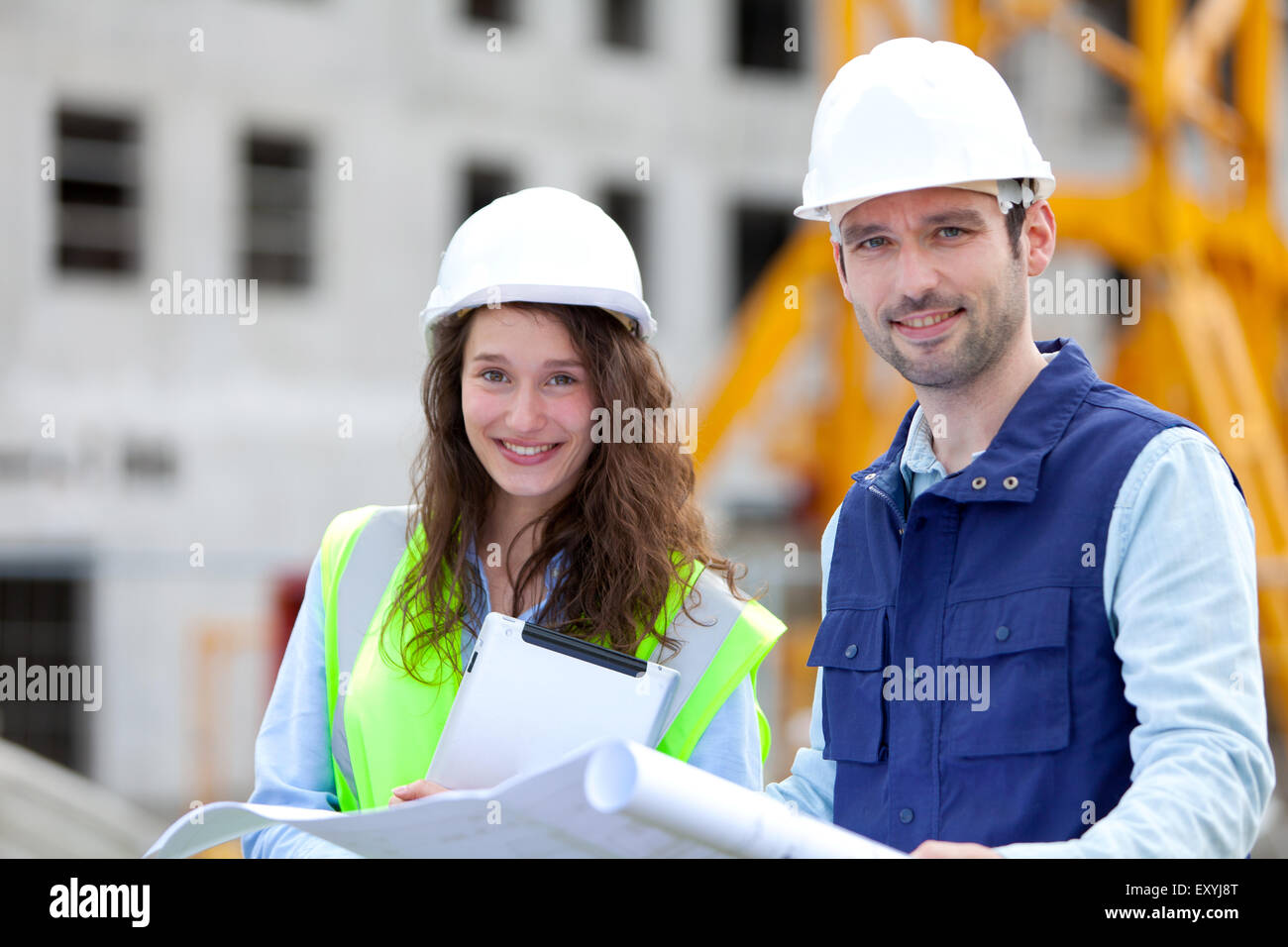 Portrait of co-workers on a construction site Stock Photo - Alamy