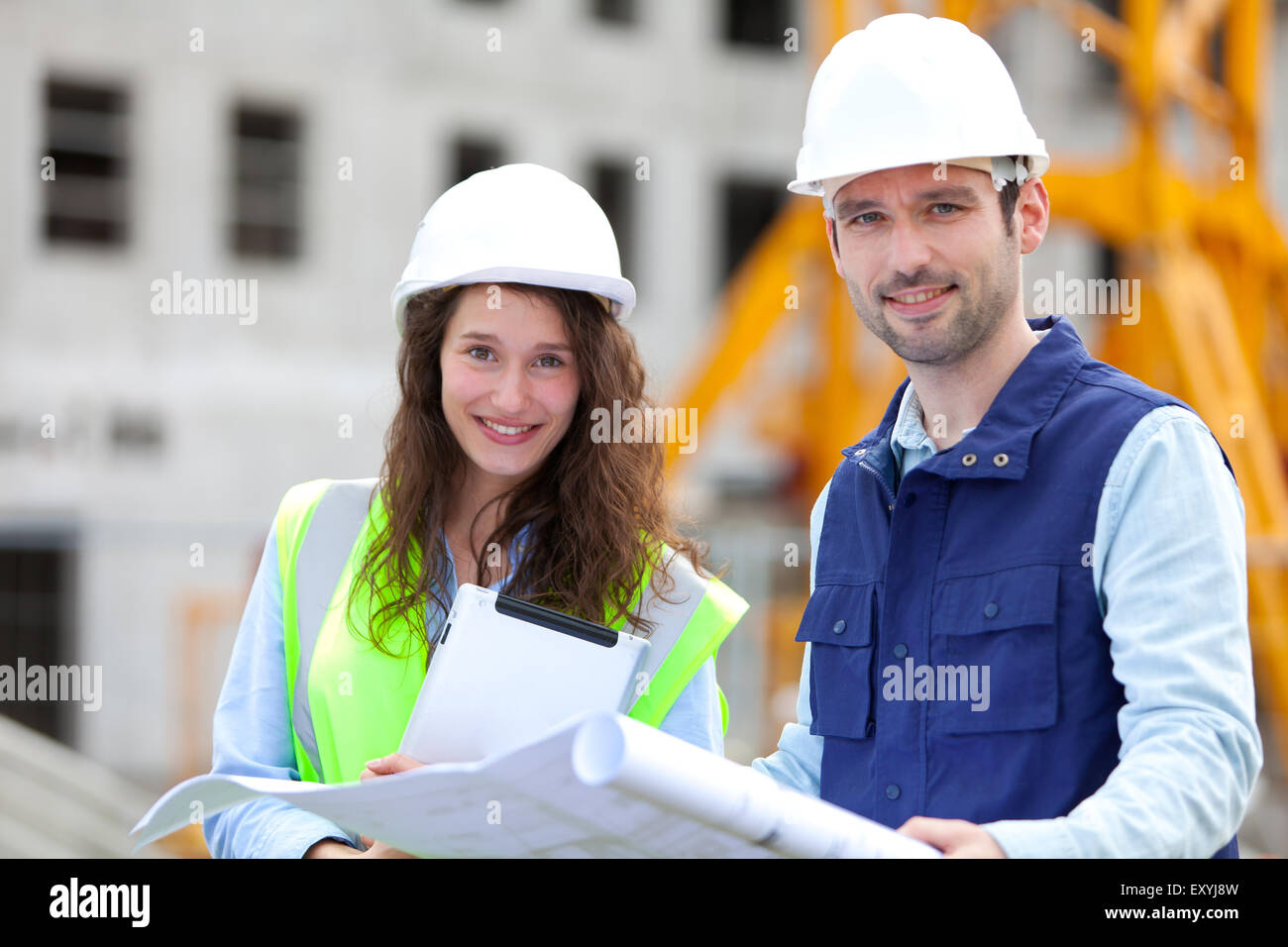 Portrait of co-workers on a construction site Stock Photo - Alamy