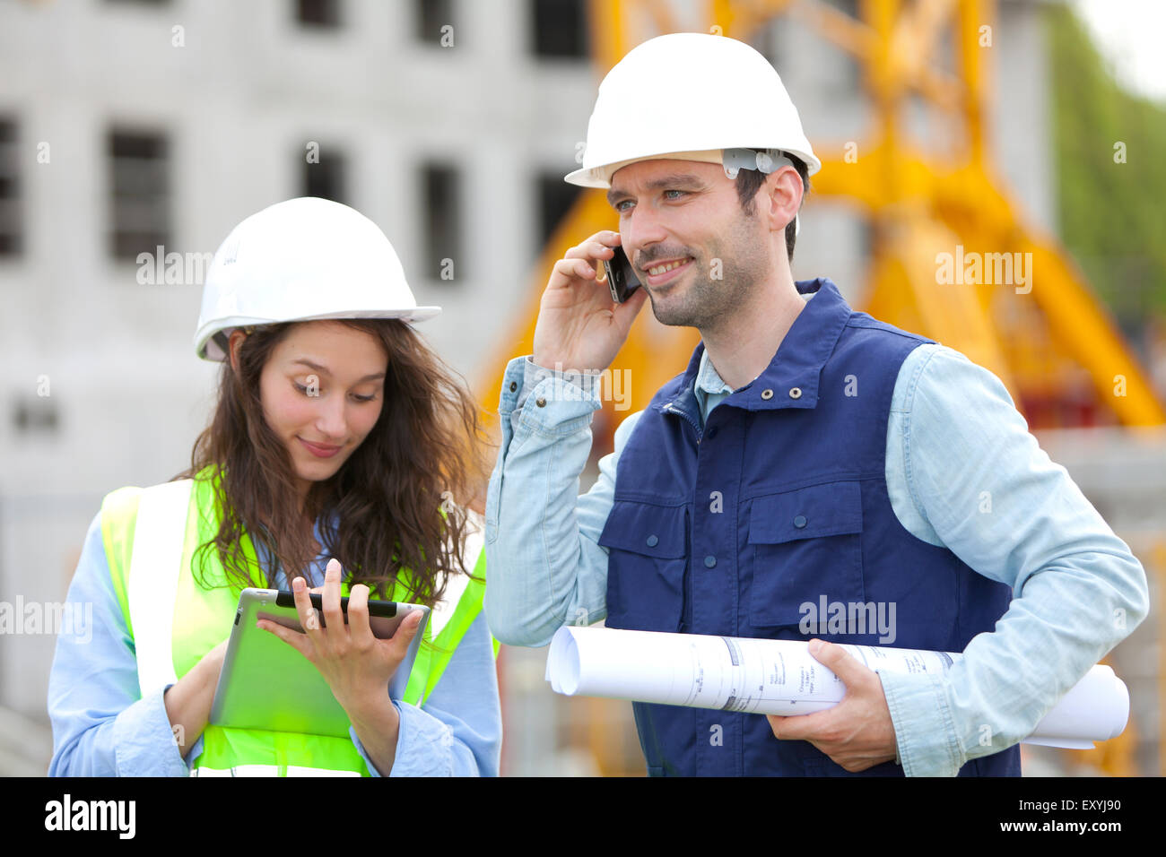 Portrait of co-workers on a construction site Stock Photo - Alamy