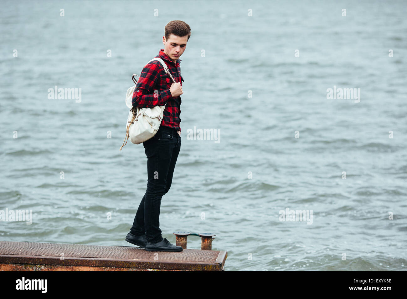 man standing on a pier Stock Photo - Alamy