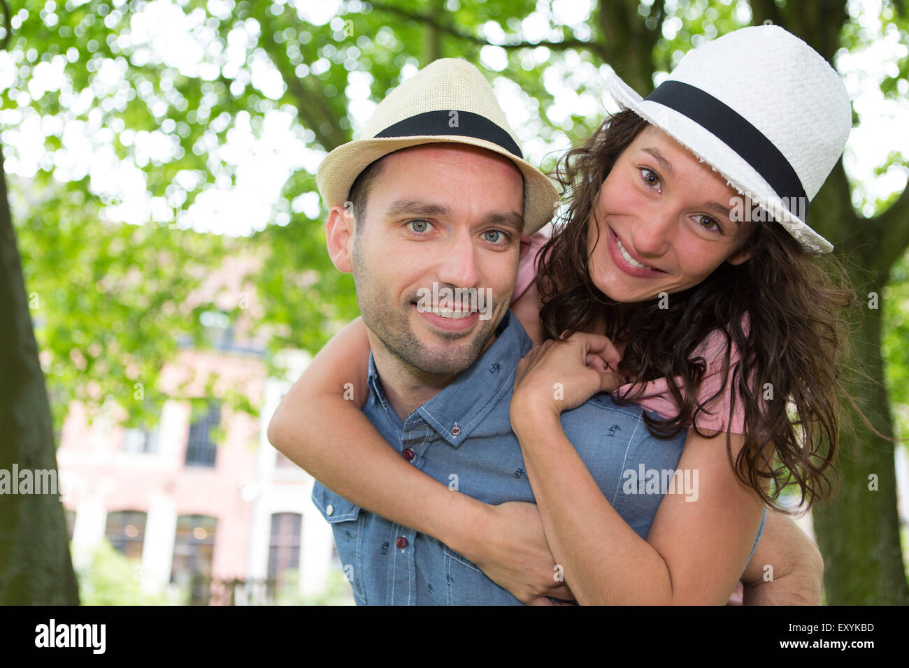Man with hat having fun with a young woman hi-res stock photography and ...