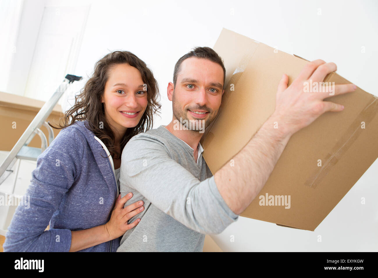 View of a Young couple in love moved in their new flat Stock Photo - Alamy