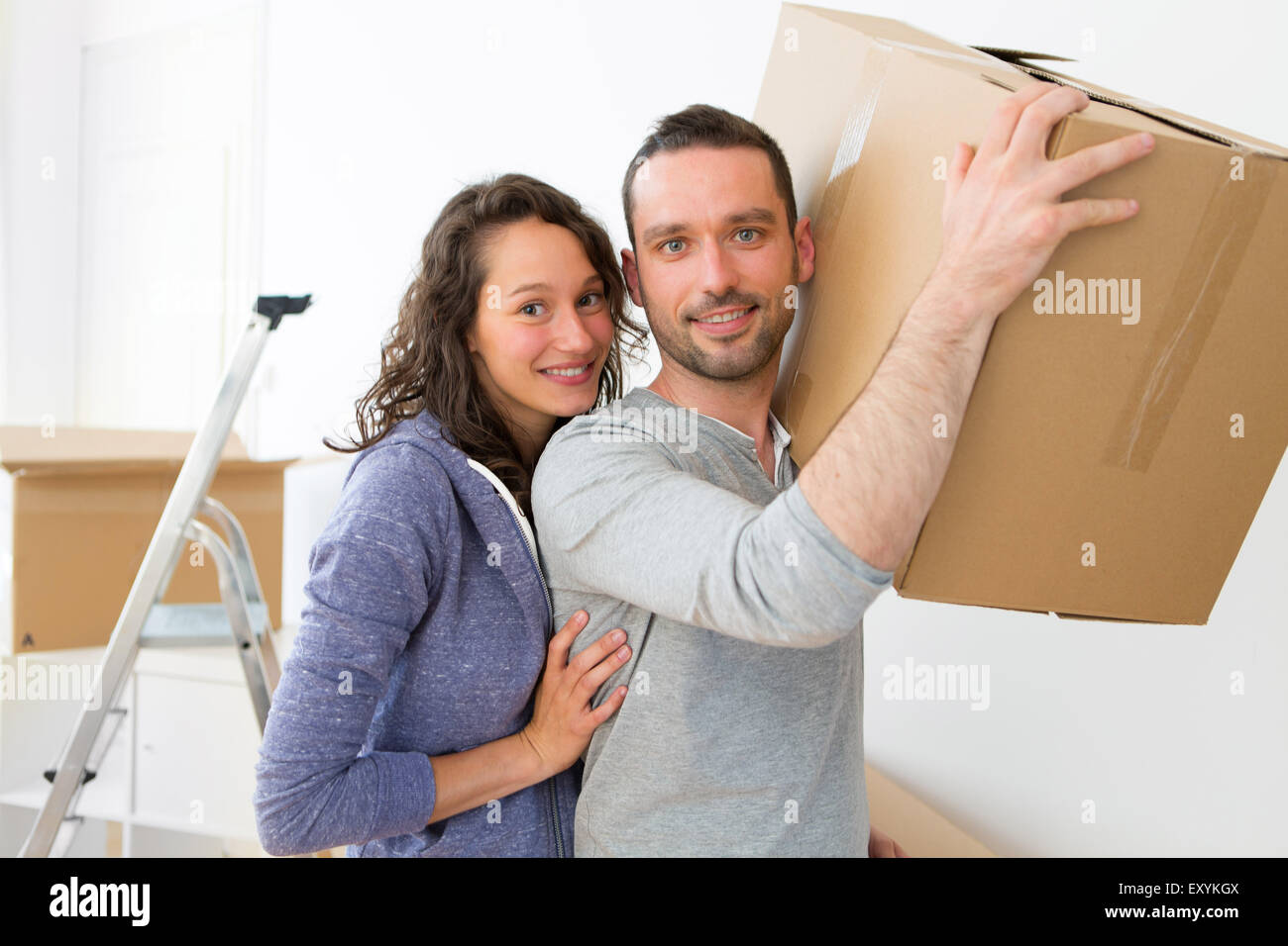 View of a Young couple in love moved in their new flat Stock Photo - Alamy