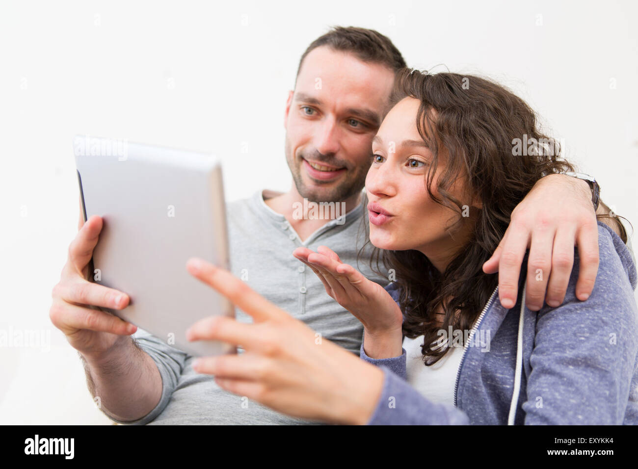 View of a Young happy couple video calling on tablet Stock Photo - Alamy