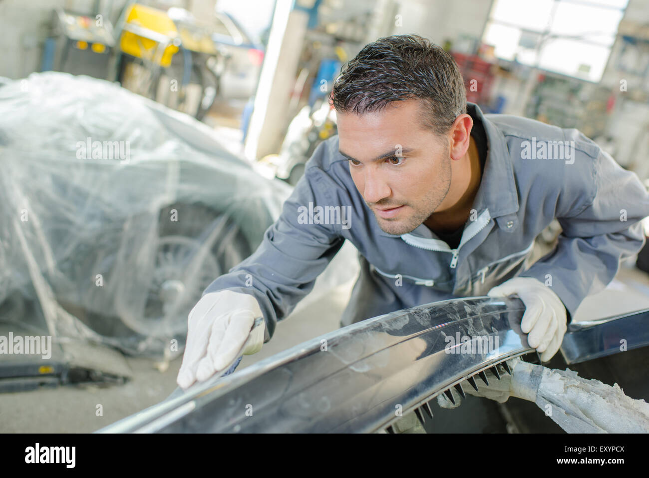 Mechanic sanding car bodywork hi-res stock photography and images - Alamy