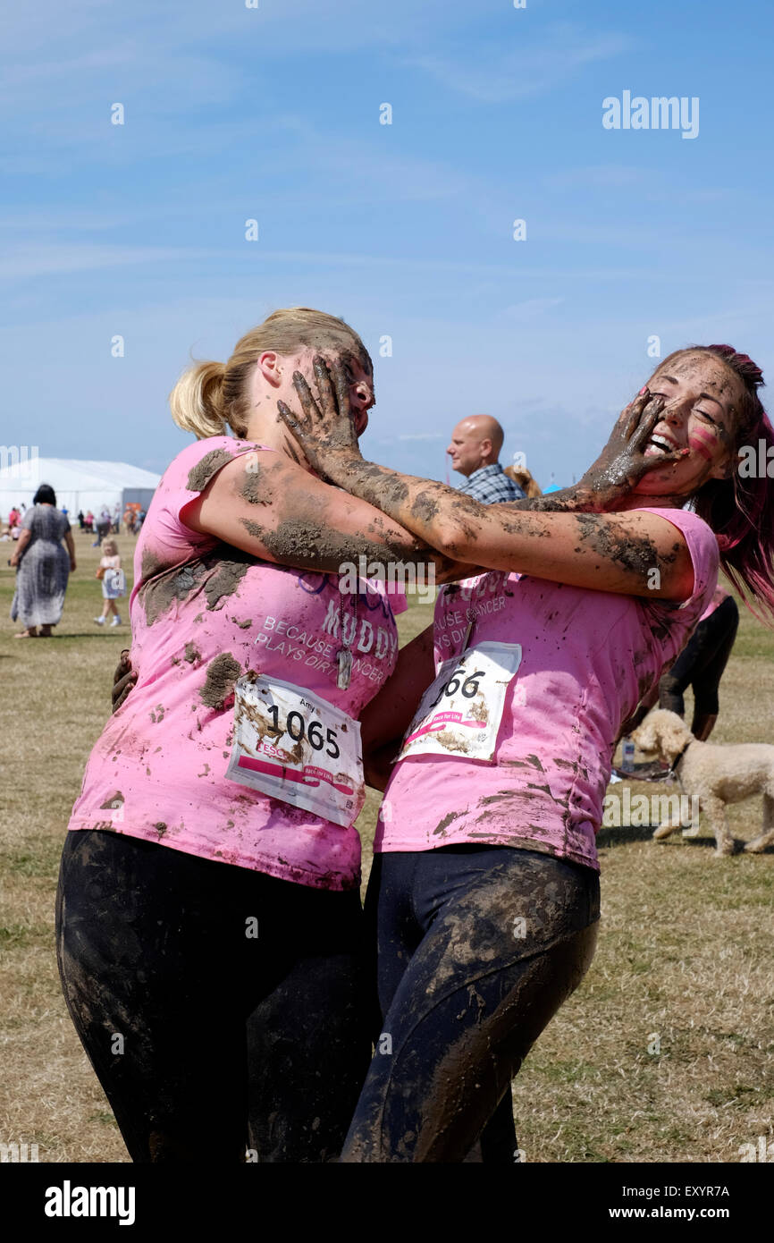 competitors take part in the 5k muddy race for life in aid of cancer ...