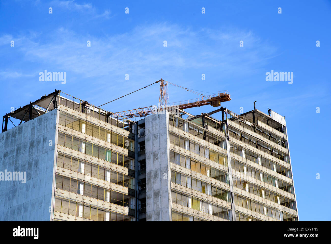 photo showing the demolition of a skyscraper with a high crane Stock ...