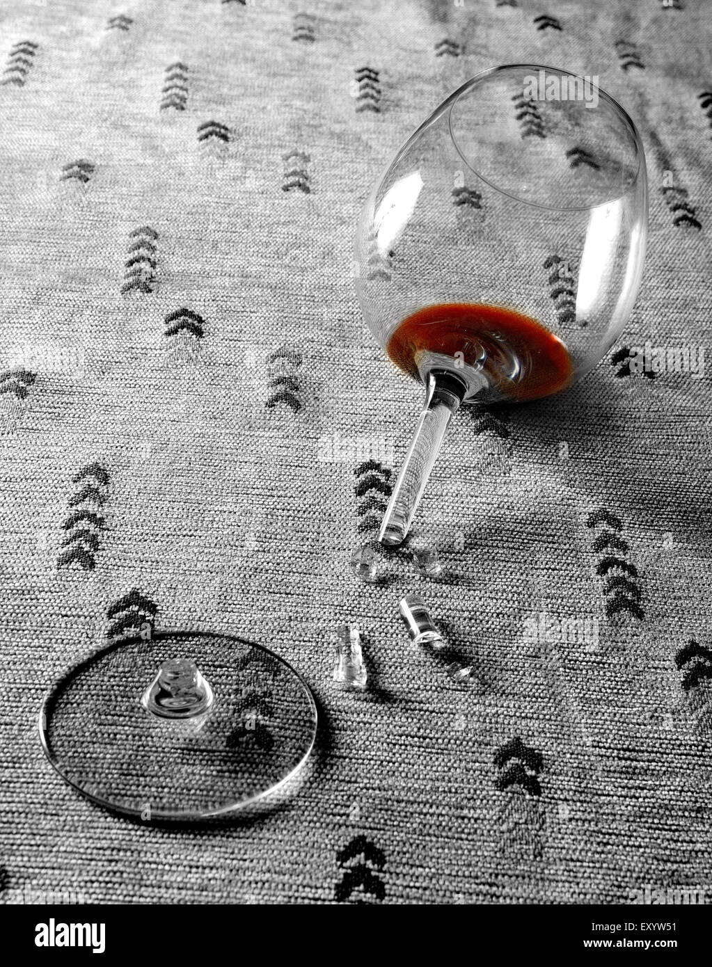 Red wine in broken glass half desaturated Stock Photo - Alamy