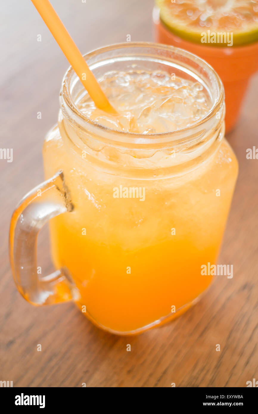 Fresh orange juice serving on wooden table, stock photo Stock Photo - Alamy