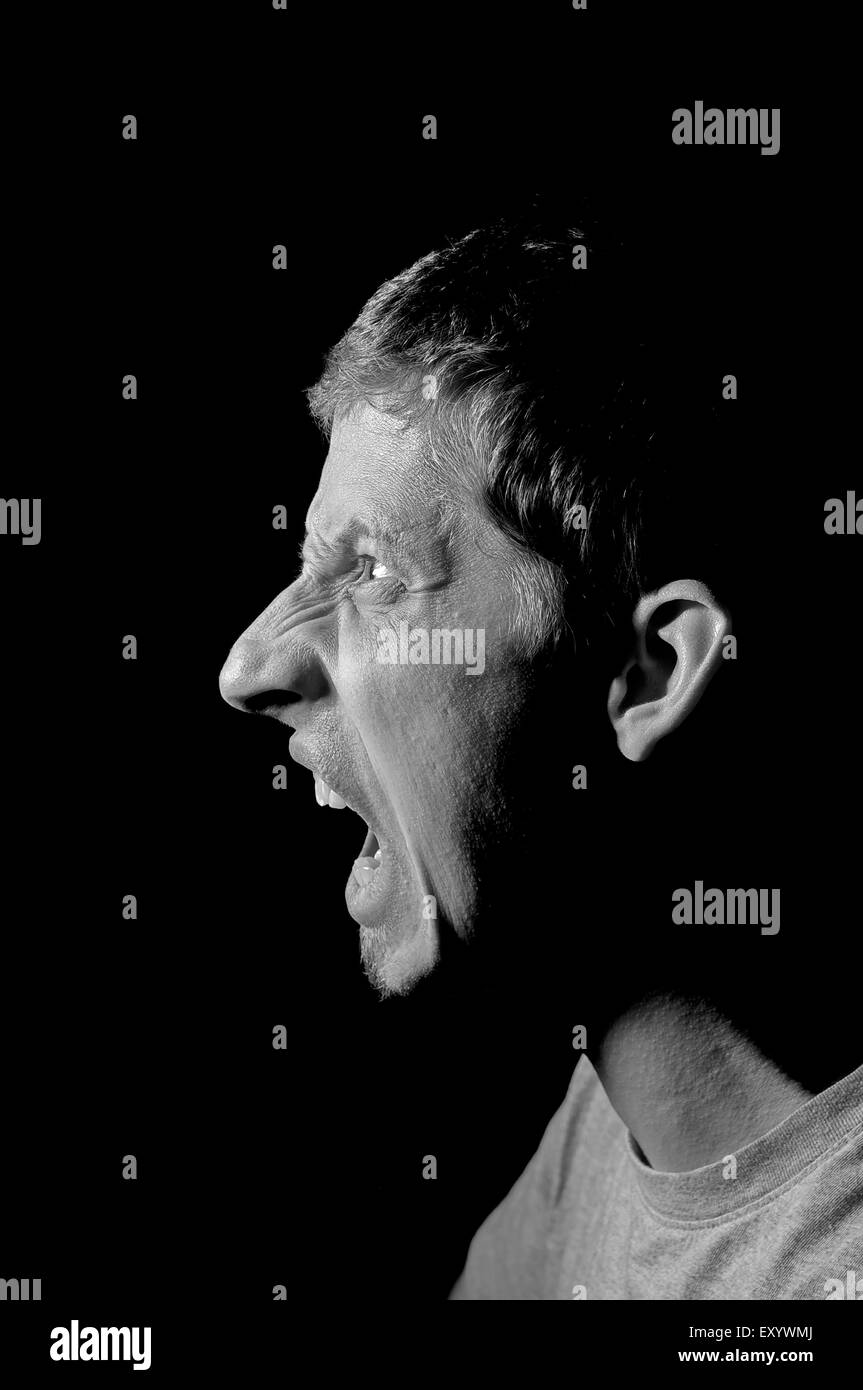 Young caucasian man screaming Stock Photo - Alamy