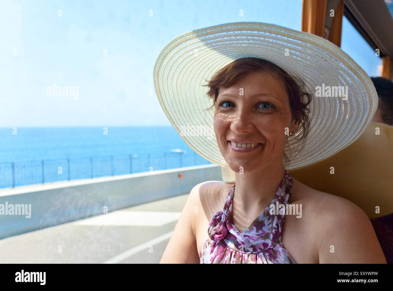 Happy middle age woman traveling in the bus Stock Photo - Alamy